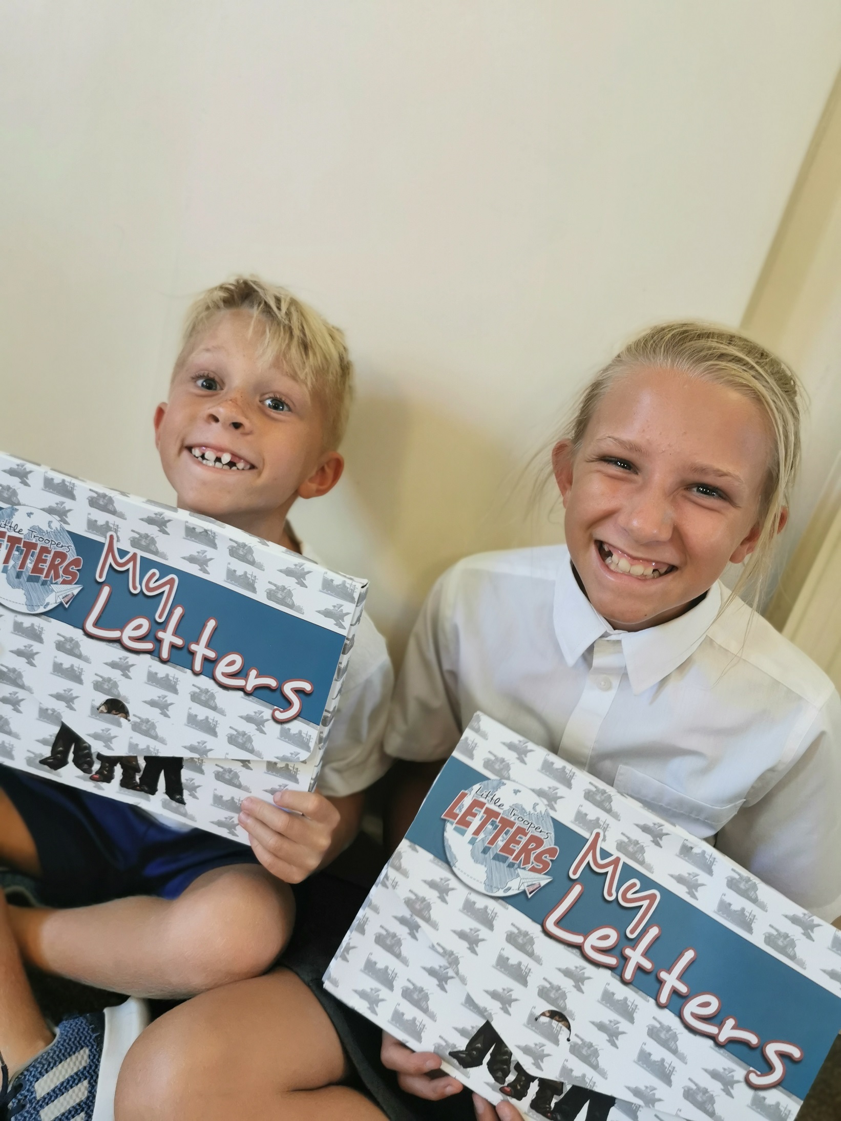 Leo and Isabelle with their Little Troopers Letters packs - Army&You